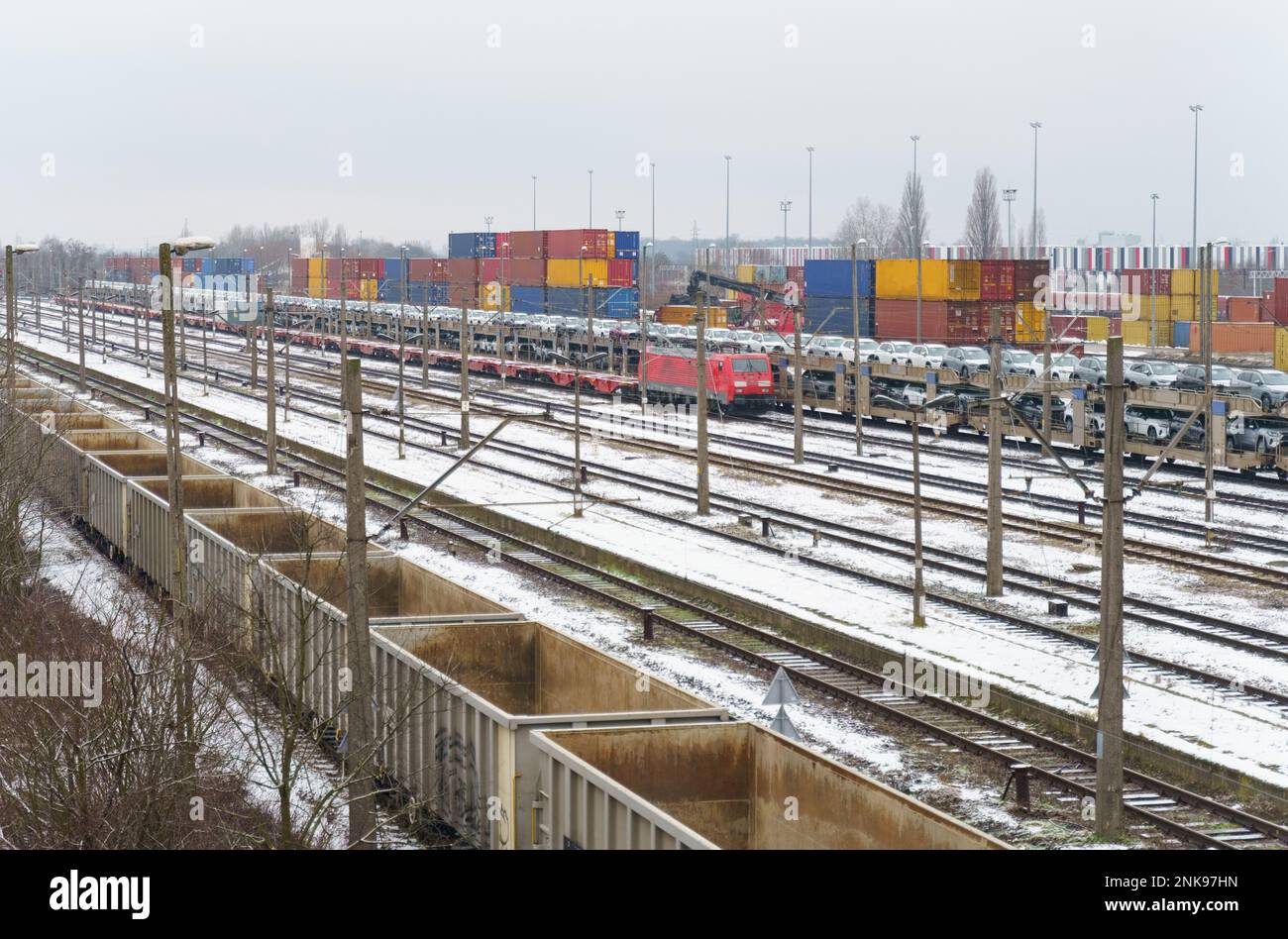 Freight unloading and loading railway station. On the platform there ...