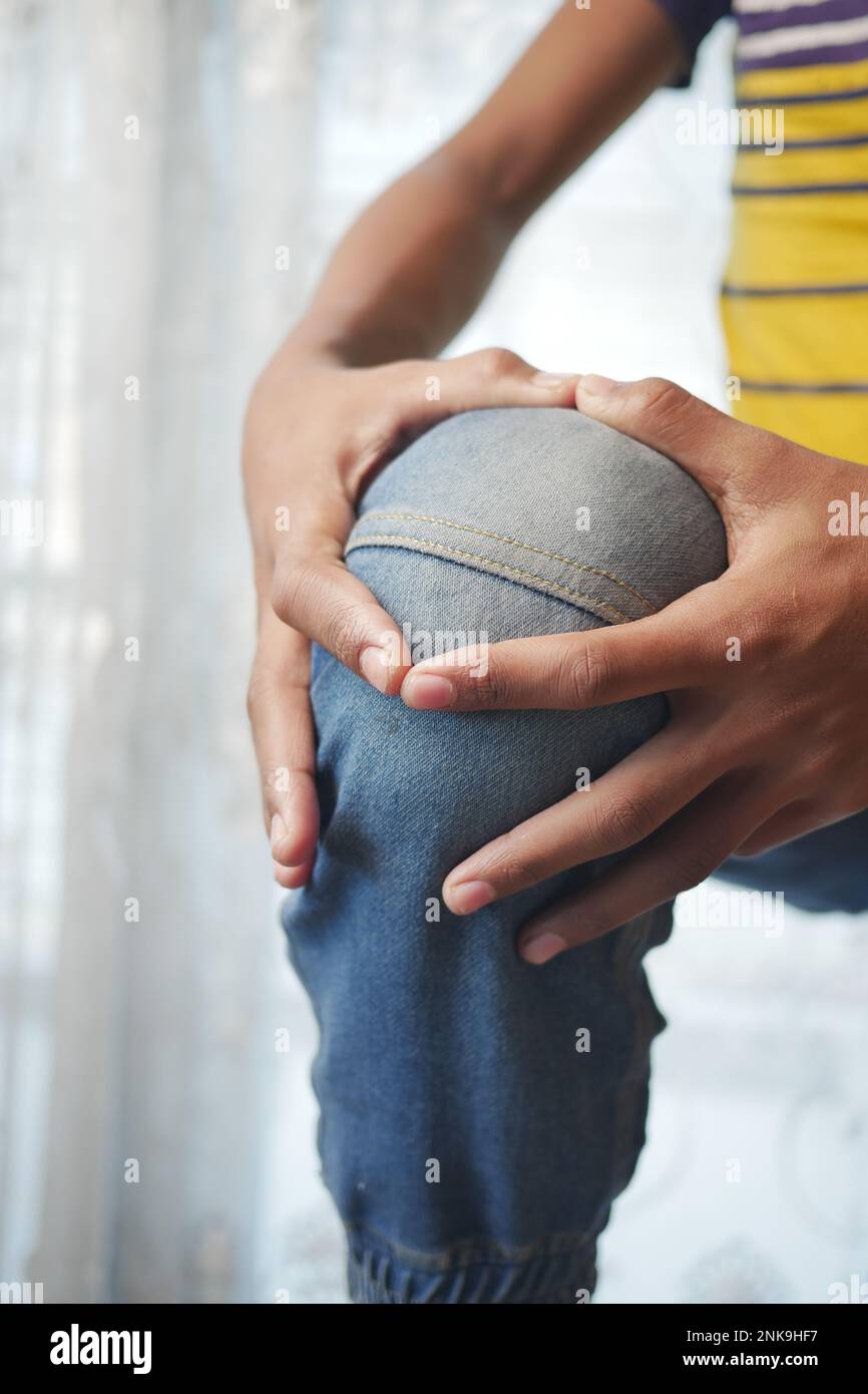 Close up on man suffering knee joint pain Stock Photo - Alamy
