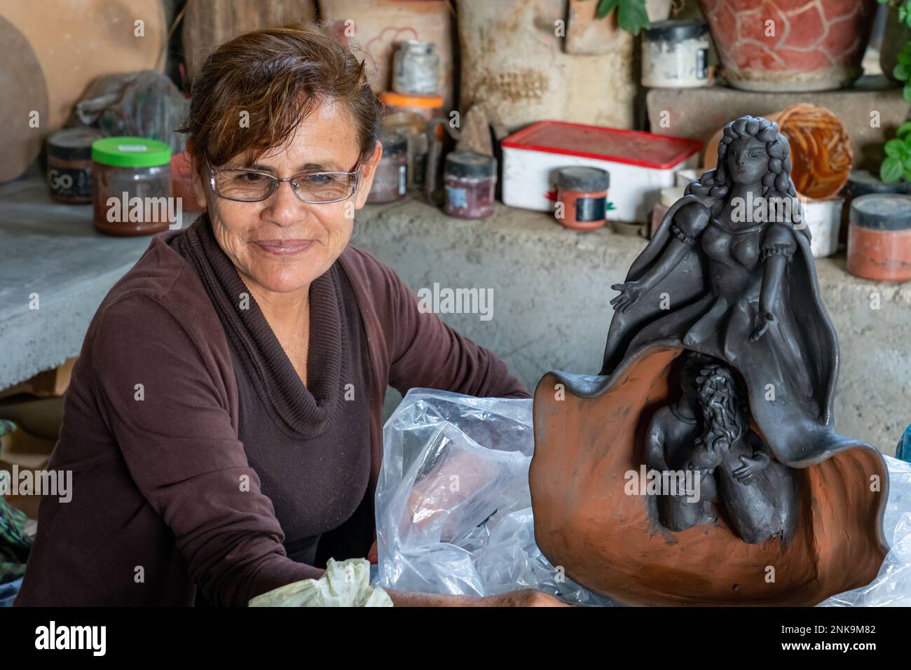 Master ceramic artist Angelica Delina Vazquez Cruz working in her ...