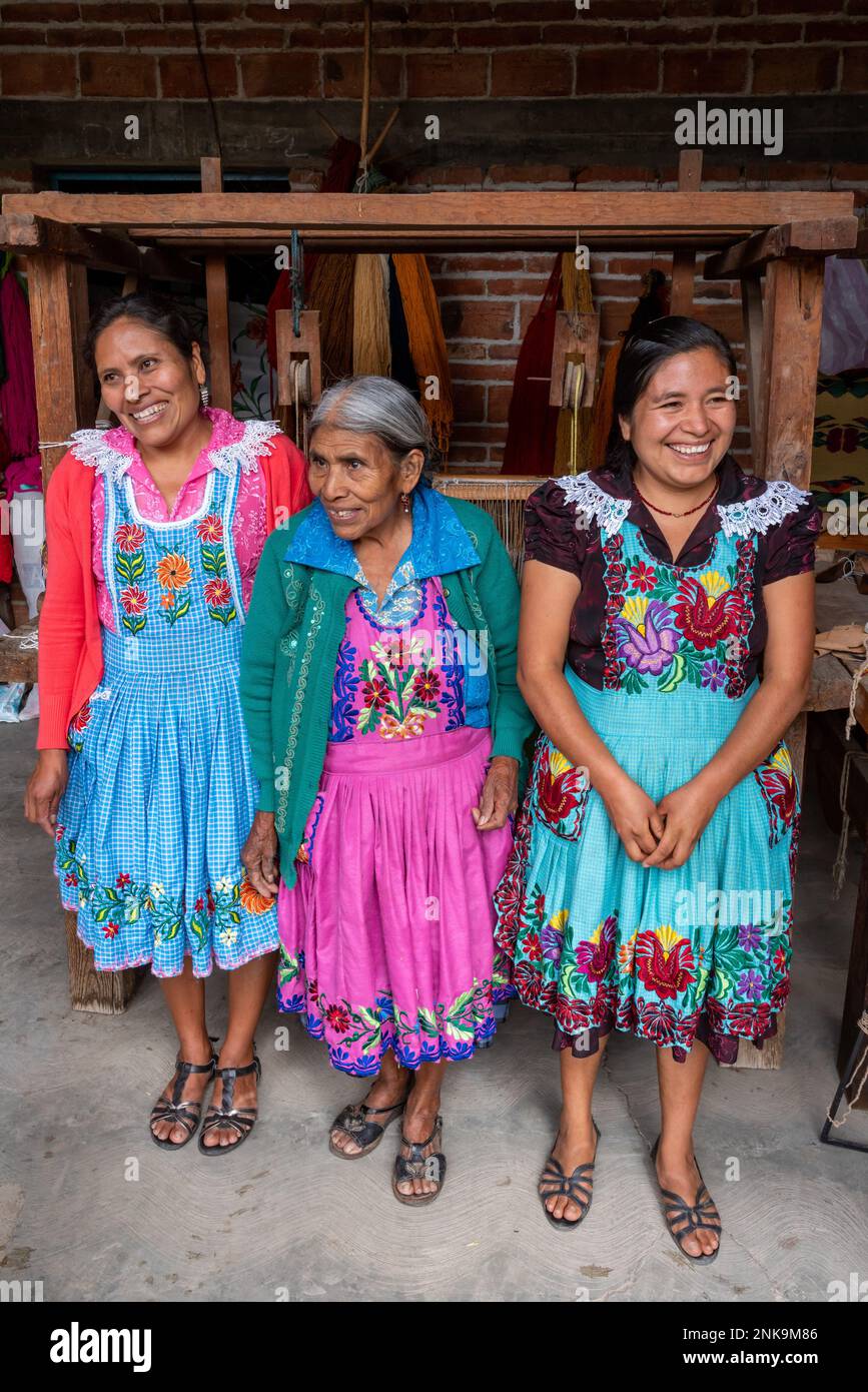 Three indigenous Zapotec women in traditional dress of embroidered ...