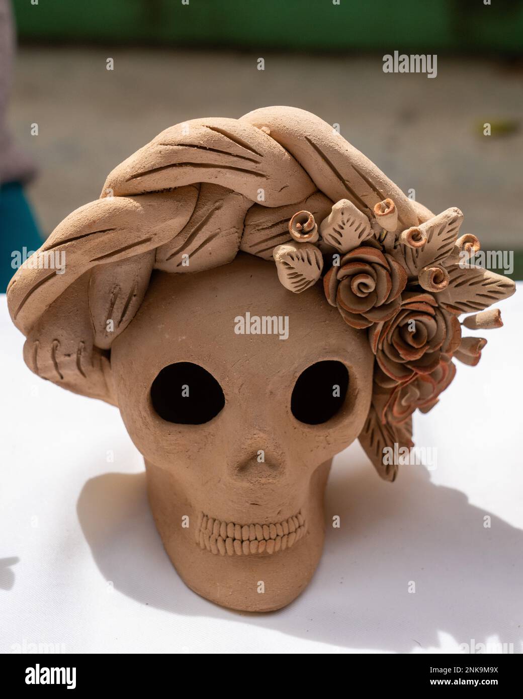 Ceramic skull with flowers celebrating Day of the Dead in a ceramic ...
