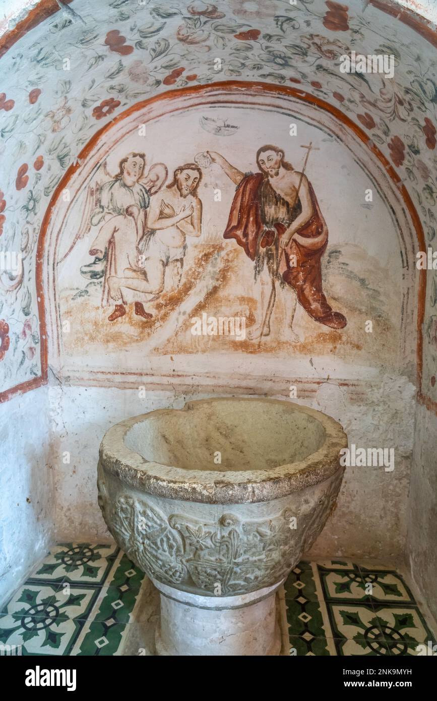 The carved stone baptistry in the Spanish colonial Church of San Miguel ...