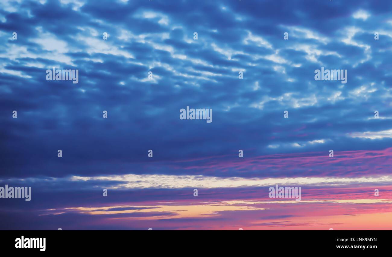 Scenic bright background. Natural sunset background, dark blue clouds ...