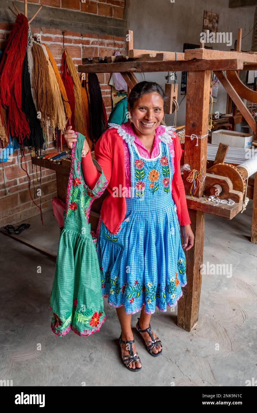 An indigenous Zapotec woman with a fancy embroidered apron she sewed in ...
