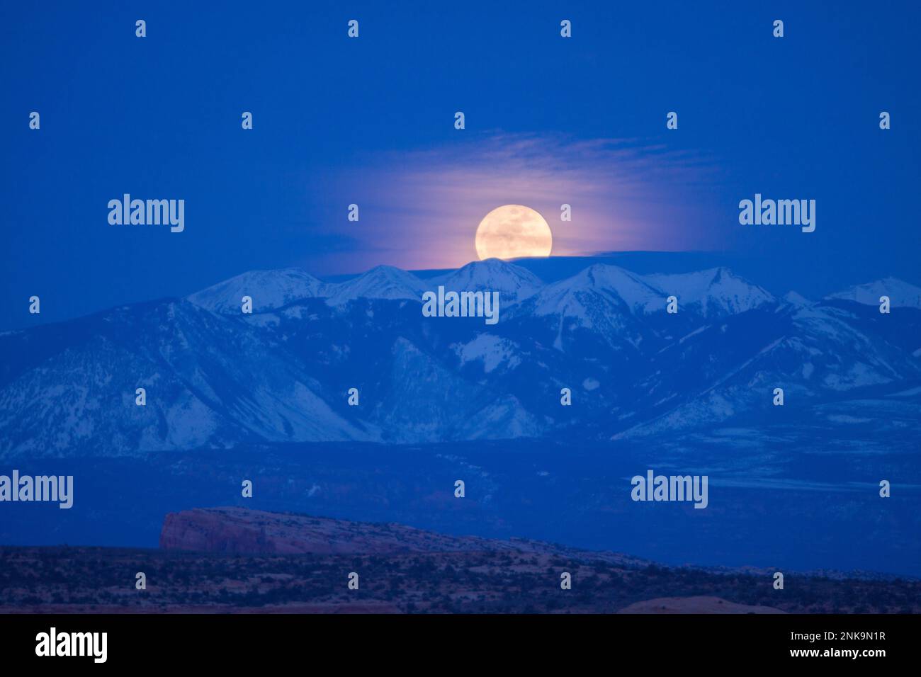 Full moon over snow capped hi-res stock photography and images - Alamy