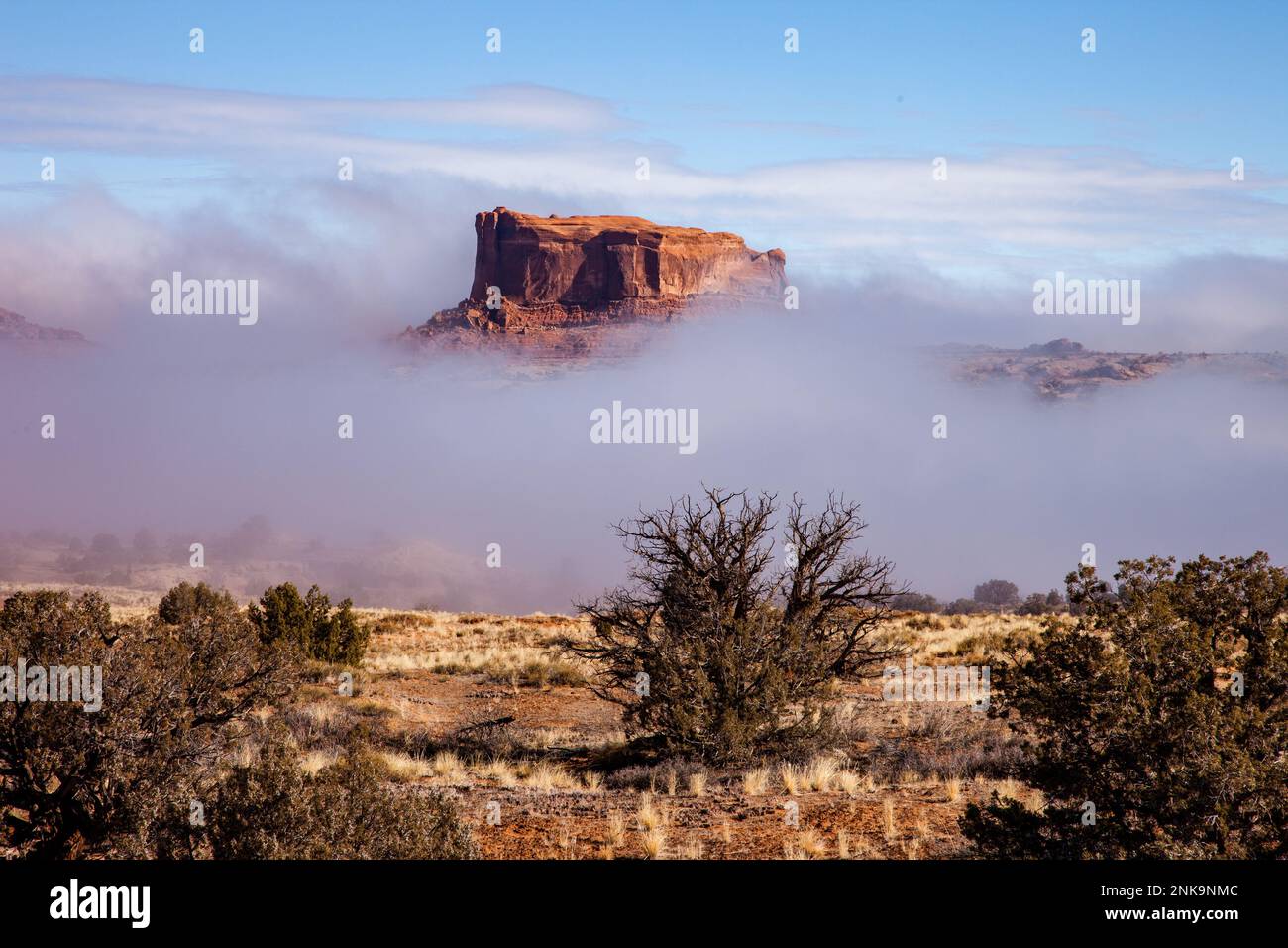 Low clouds or ground fog around the Monitor Butte near Moab, Utah Stock ...