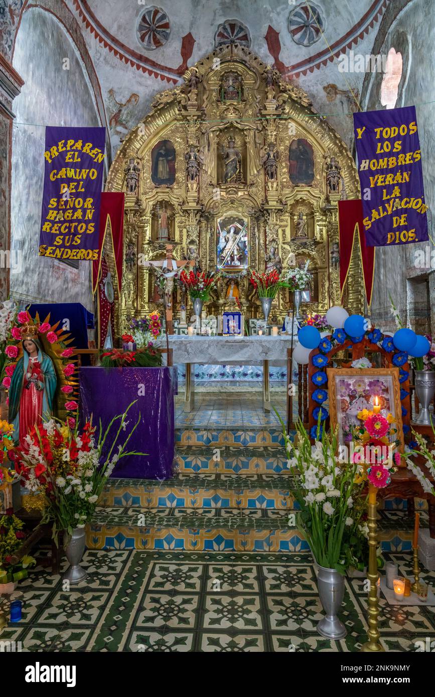 The elaborate gilded altarpeice or retablo of the Spanish colonial ...