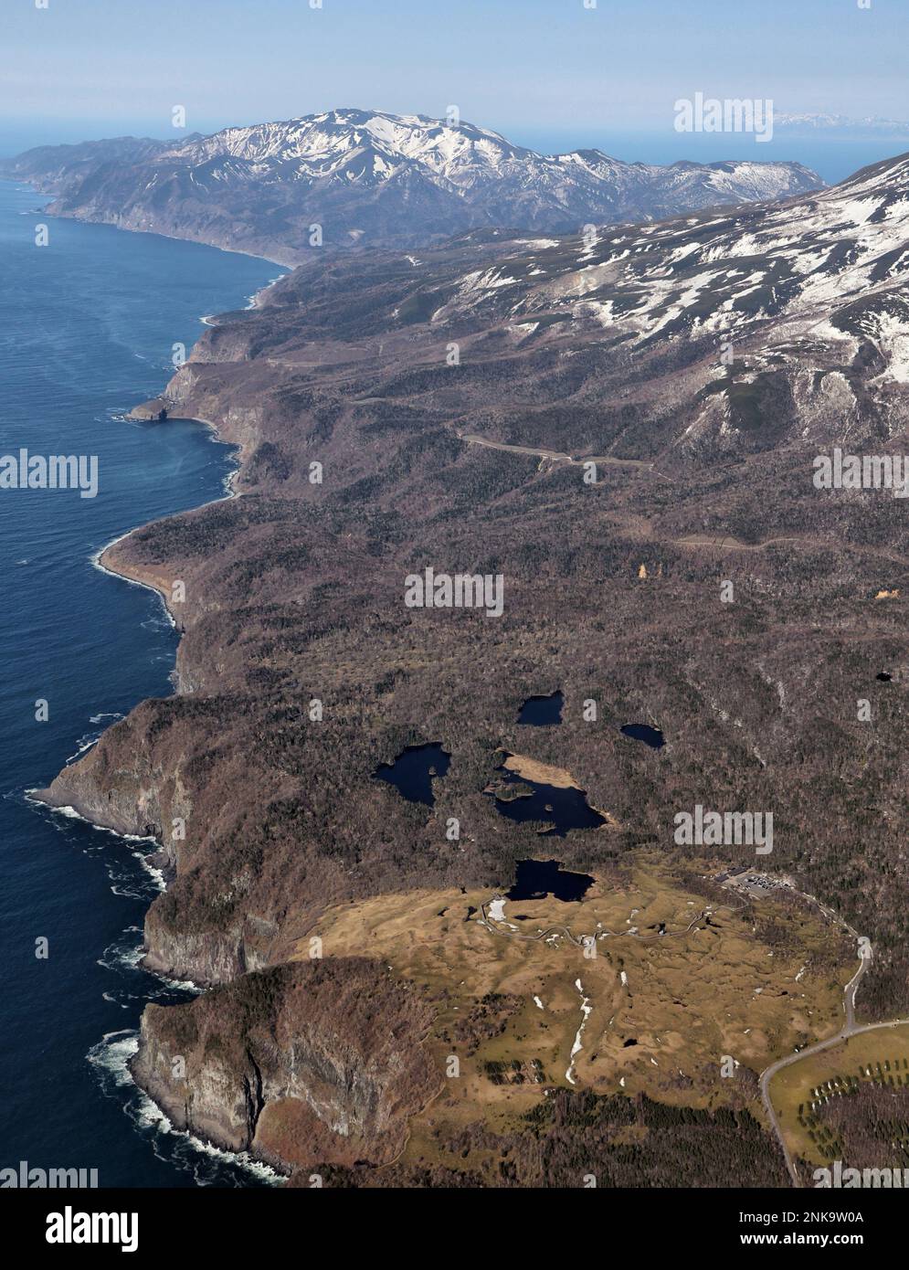 An aerial photo shows Mount Shiretoko (back), a volcano, and Shiretoko ...