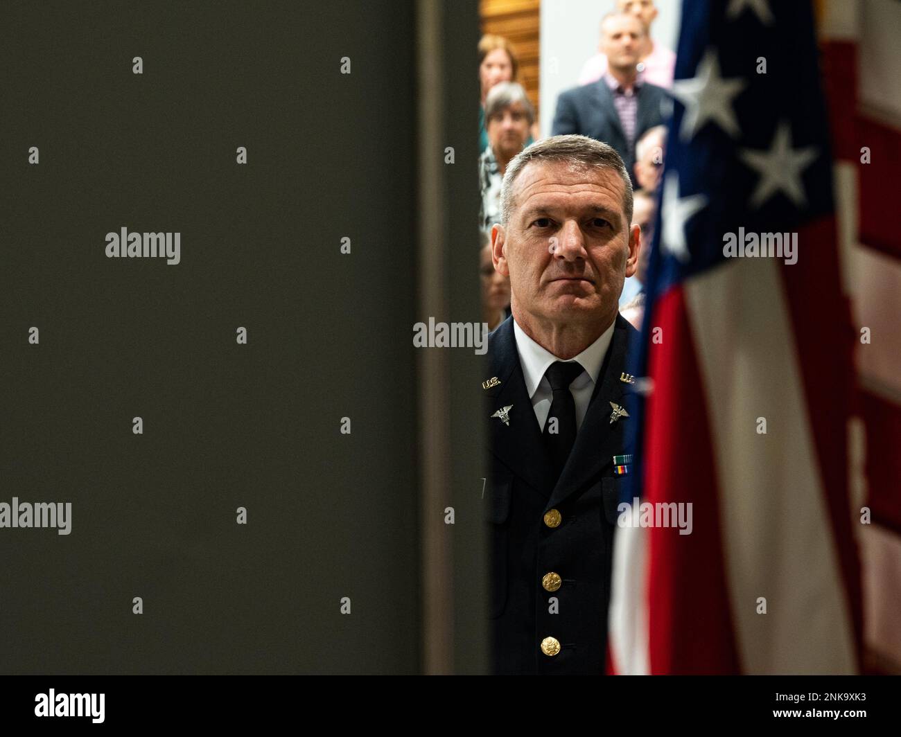 Col. Norman C. Waters stands at attention during the National Anthem as ...
