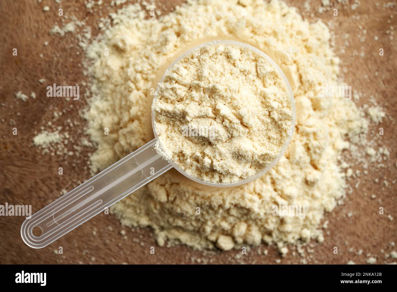 Whey protein powder in a plastic measuring cup, top view Stock Photo ...