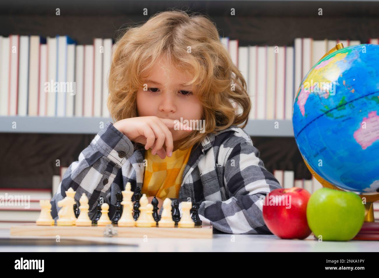 Kid play chess at school. Chess for intelligent kid. Child genius ...
