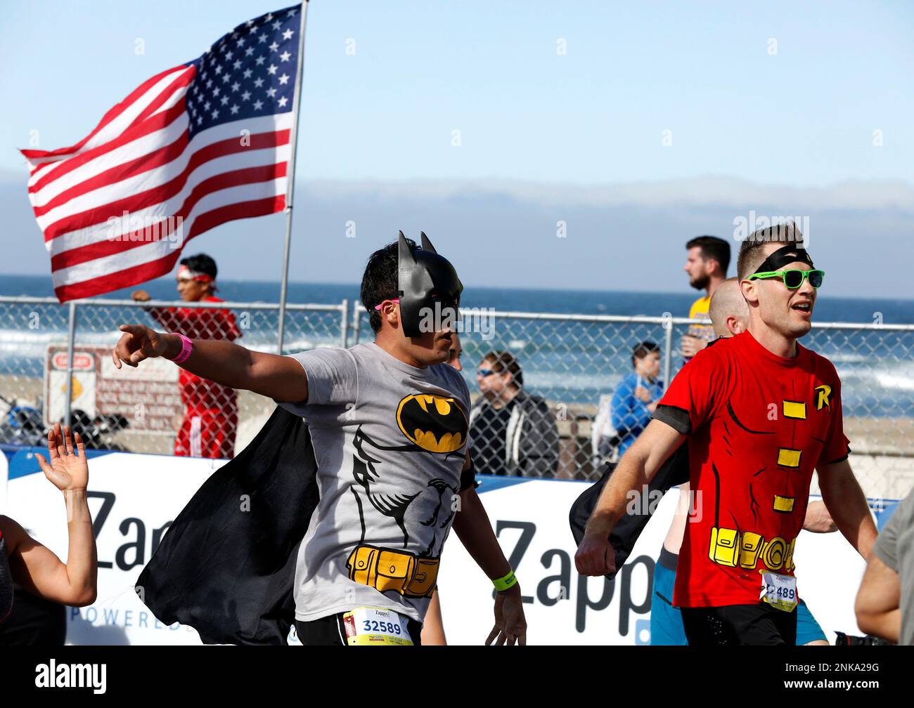 Men dressed as Batman and Robin approach the Bay to Breakers finish ...