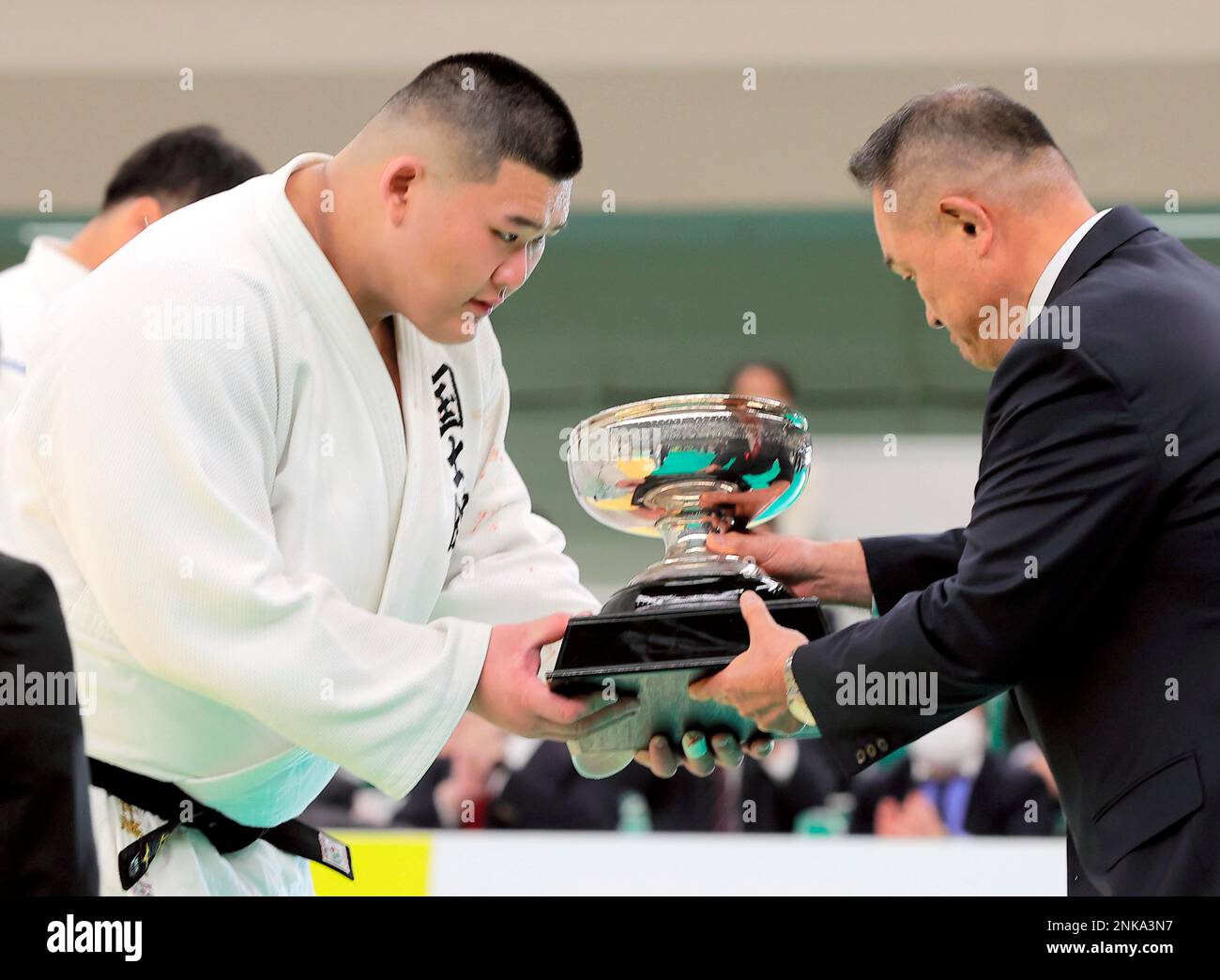 Tatsuru Saito receives a trophy after winning the All Japan Judo ...