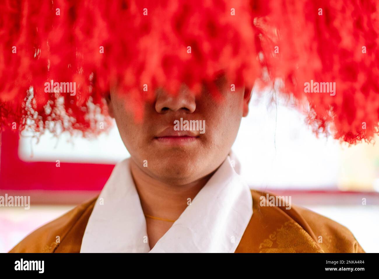 A man clad in traditional attire dance during Tibetan Gyalpo Lhosar ...