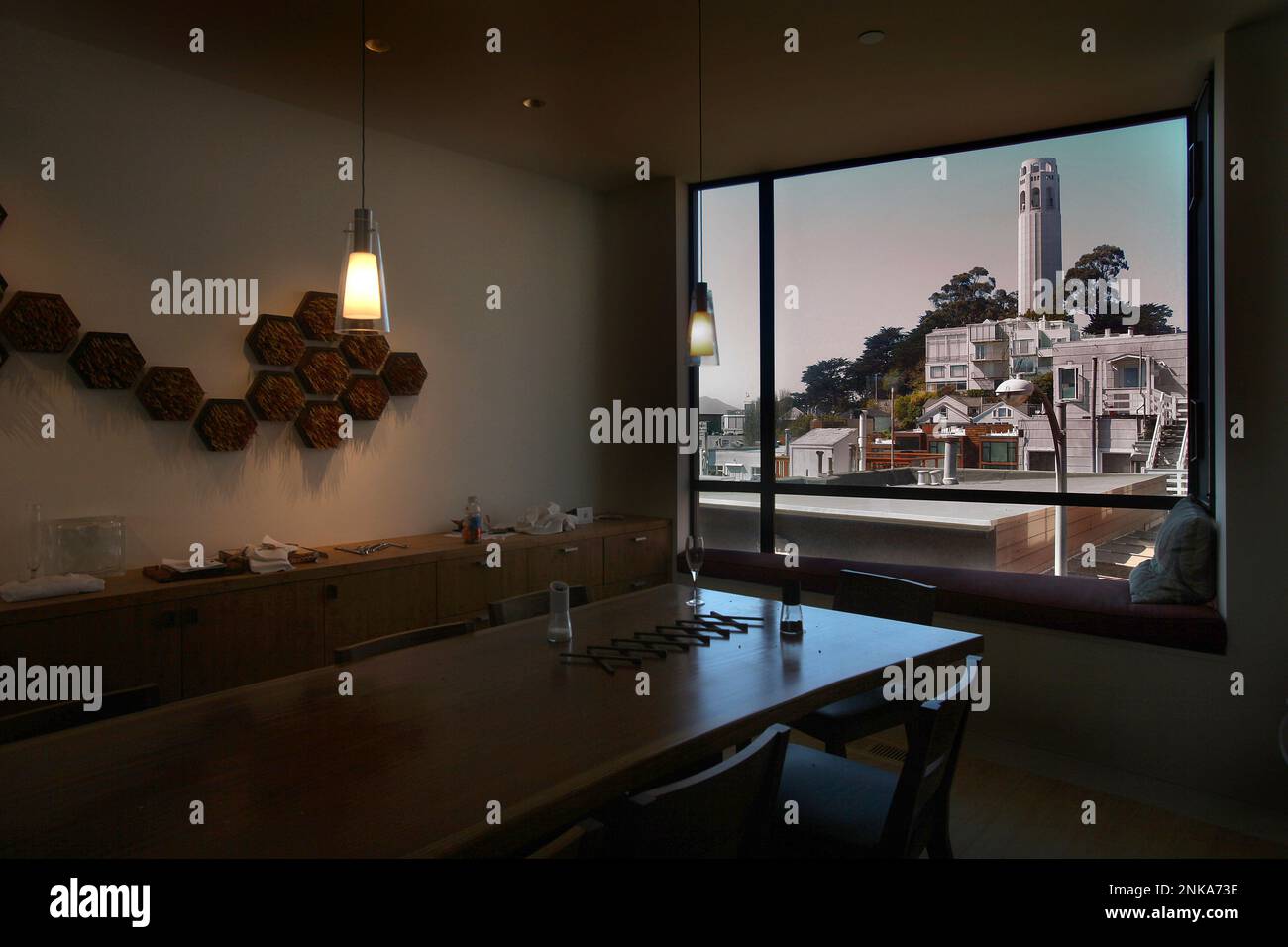 The dining room with art on wall created by glass artist Pamina Miye ...