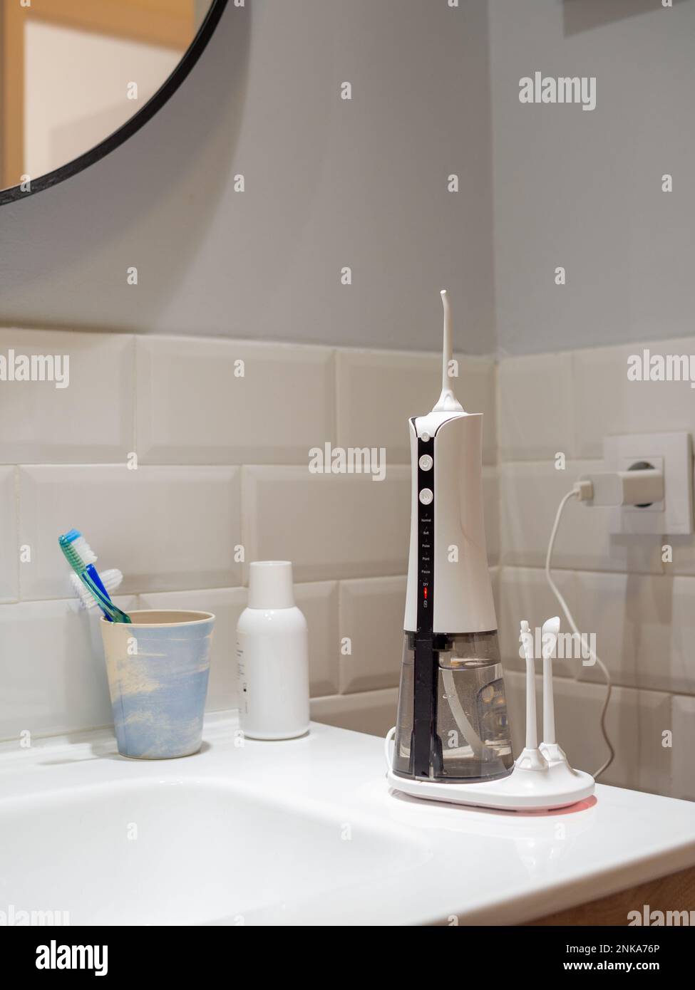 domestic dental water flosser on the bathroom wash basin Stock Photo ...