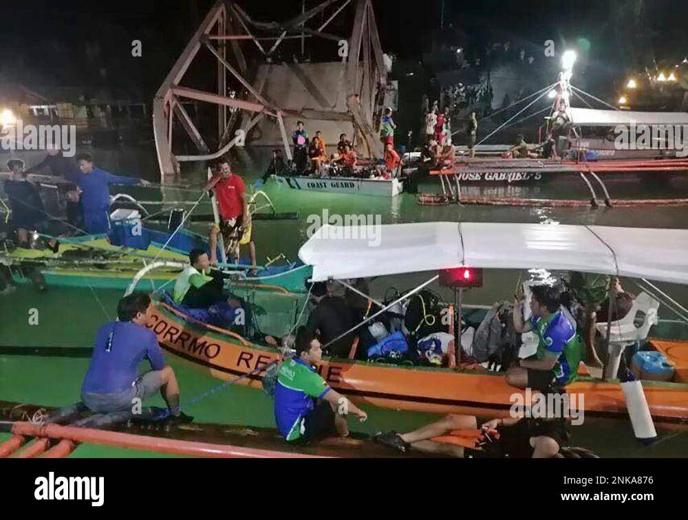 In this photo provided by the Philippine Coast Guard, rescuers conduct ...