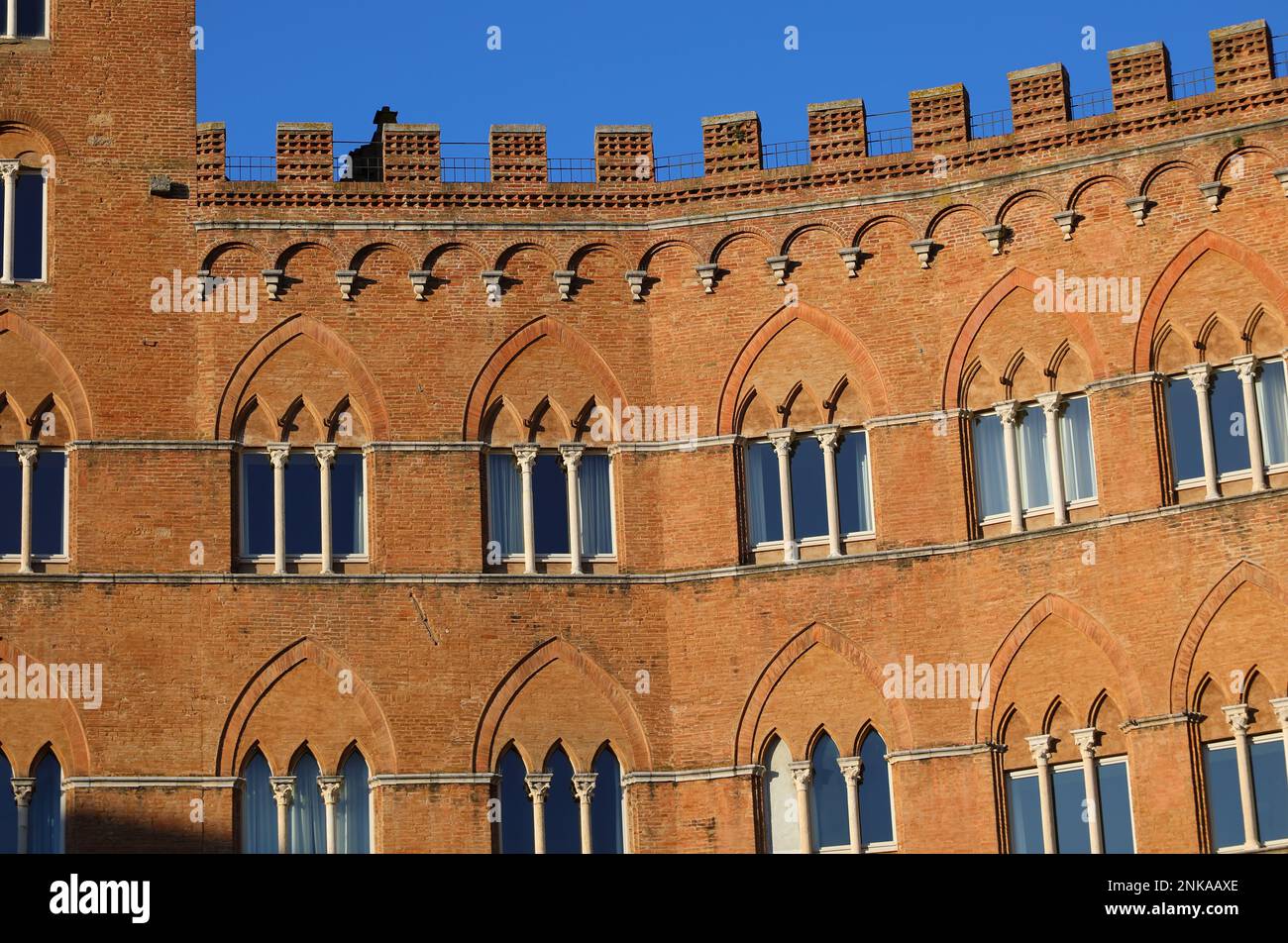 Three-mullioned windows in the ancient palace of central Italy in ...