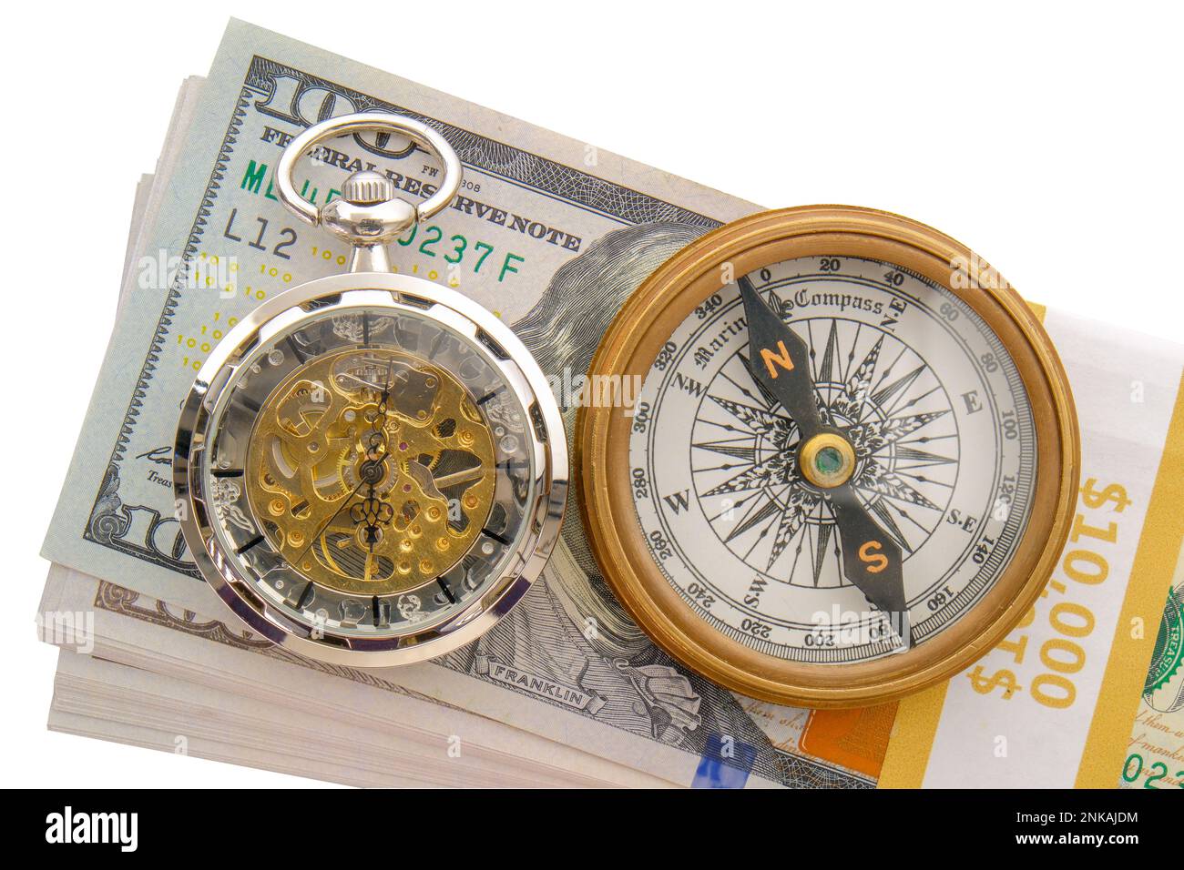 Stack of 10.000 in hundred dollar bills with a compass, modern pocket watch placed on top, white ...