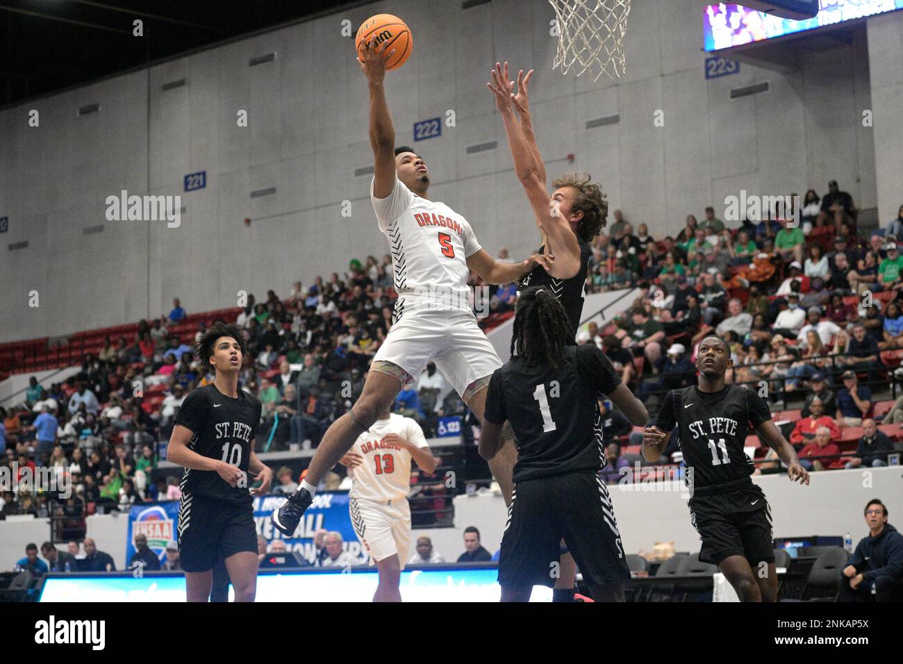Stranahan's Jaquan Adams (5) goes up for a shot in front of St ...