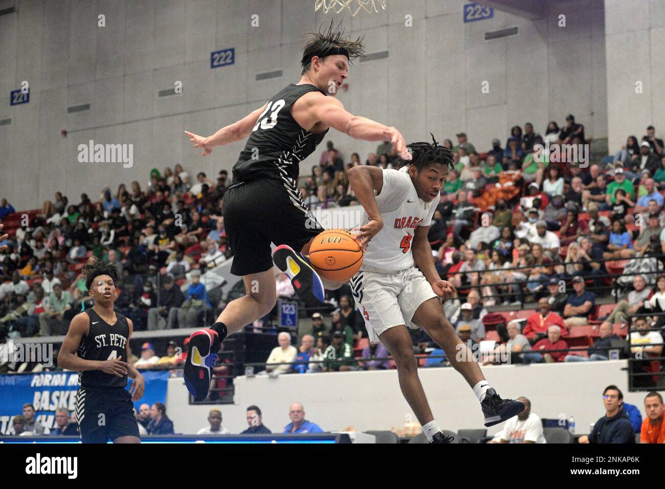 St. Petersburg's Dylan Kramer (23) defends as Stranahan's Jaylen Black ...