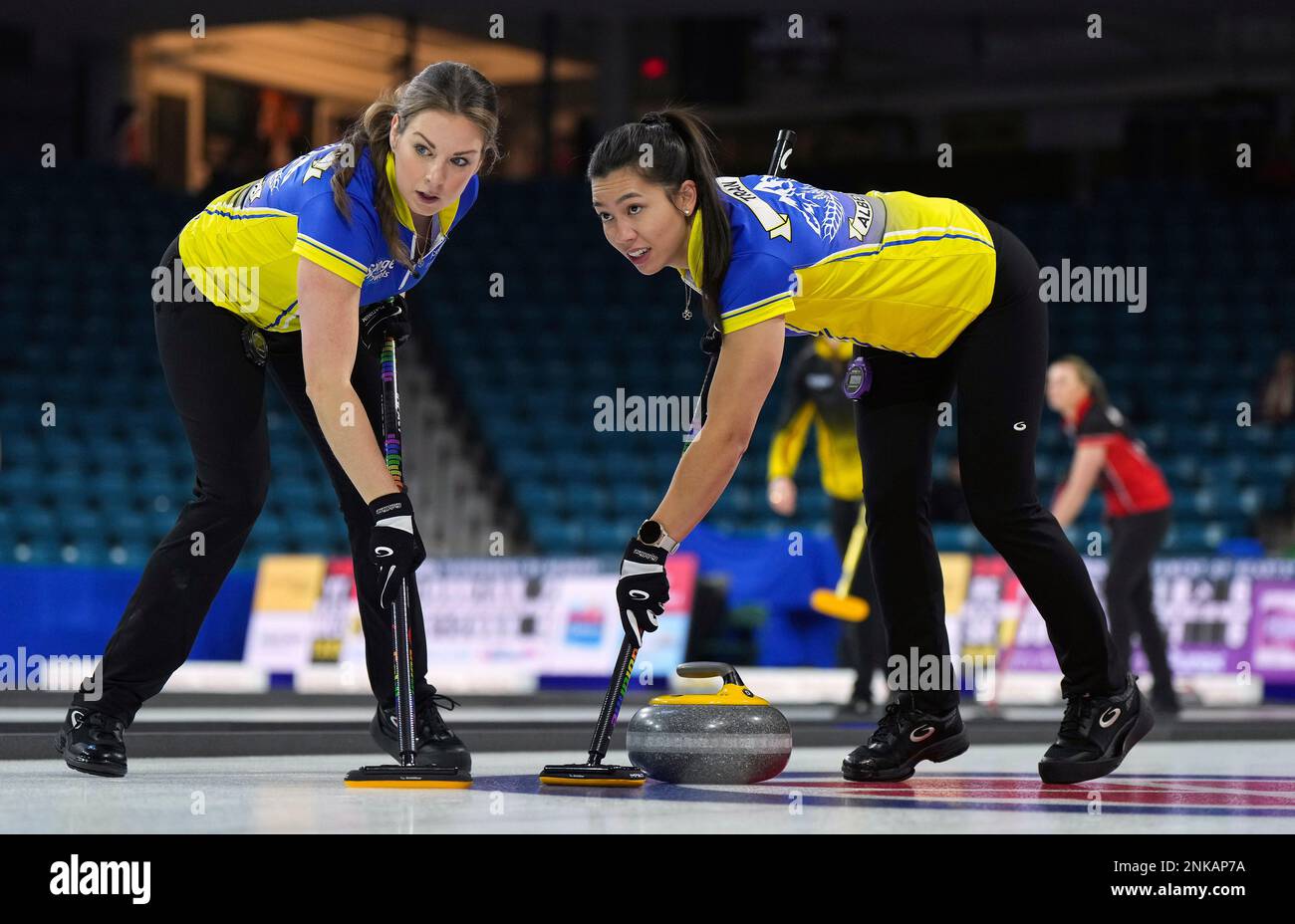 Alberta second Geri-Lynn Ramsay, left, and third Brittany Tran sweep ...