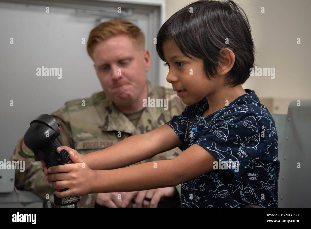 A student from Himawari School Age Care moves the controls on an F-15 ...