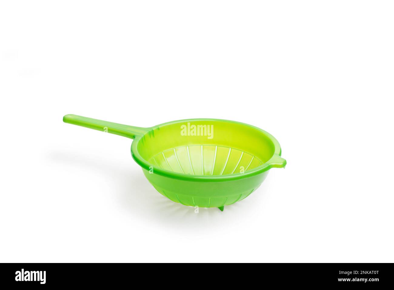 A green plastic strainer on a white background with copy space Stock ...