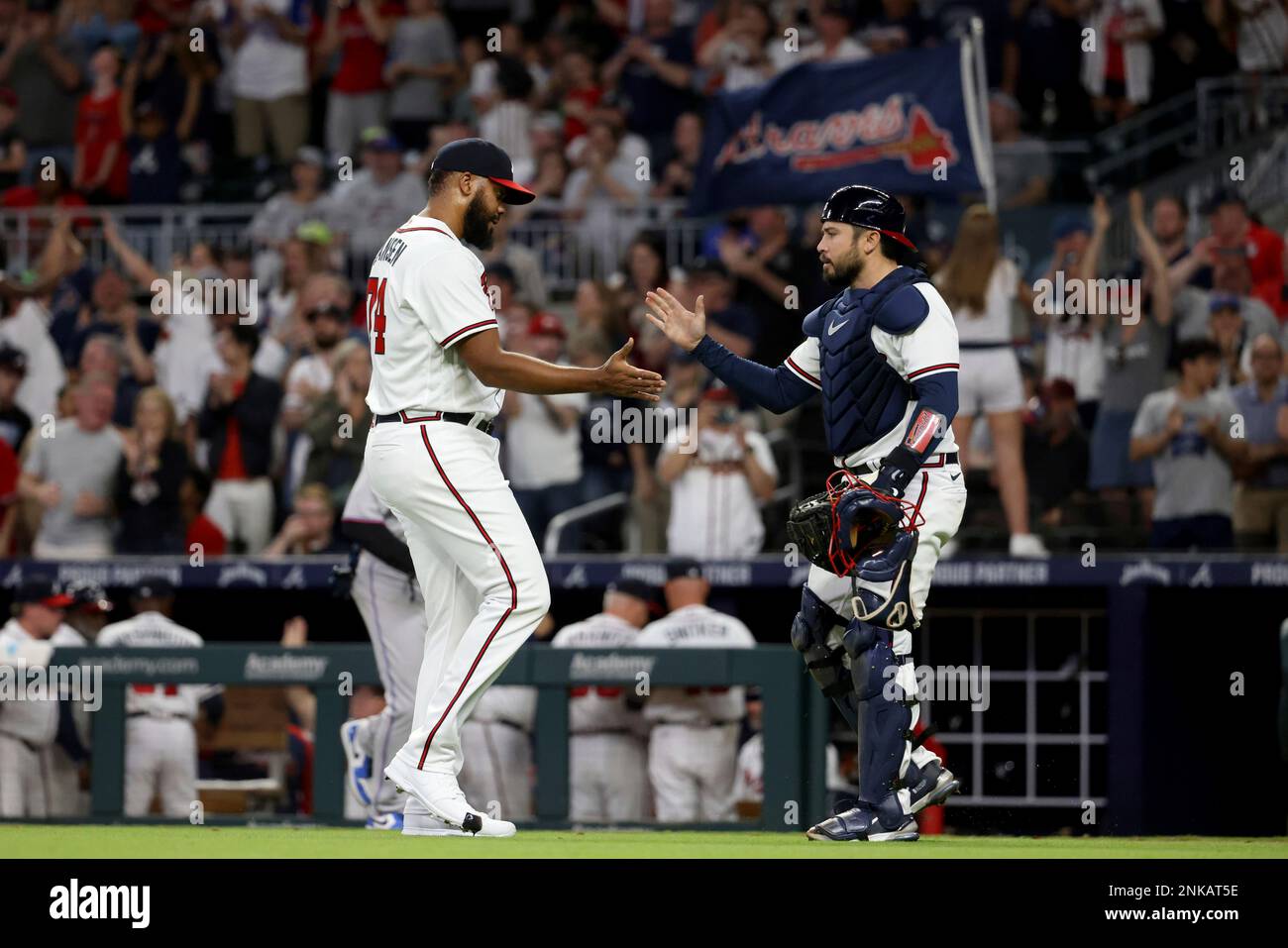 Atlanta Braves relief pitcher Kenley Jansen, left, and catcher Travis d'Arnaud react after the ...