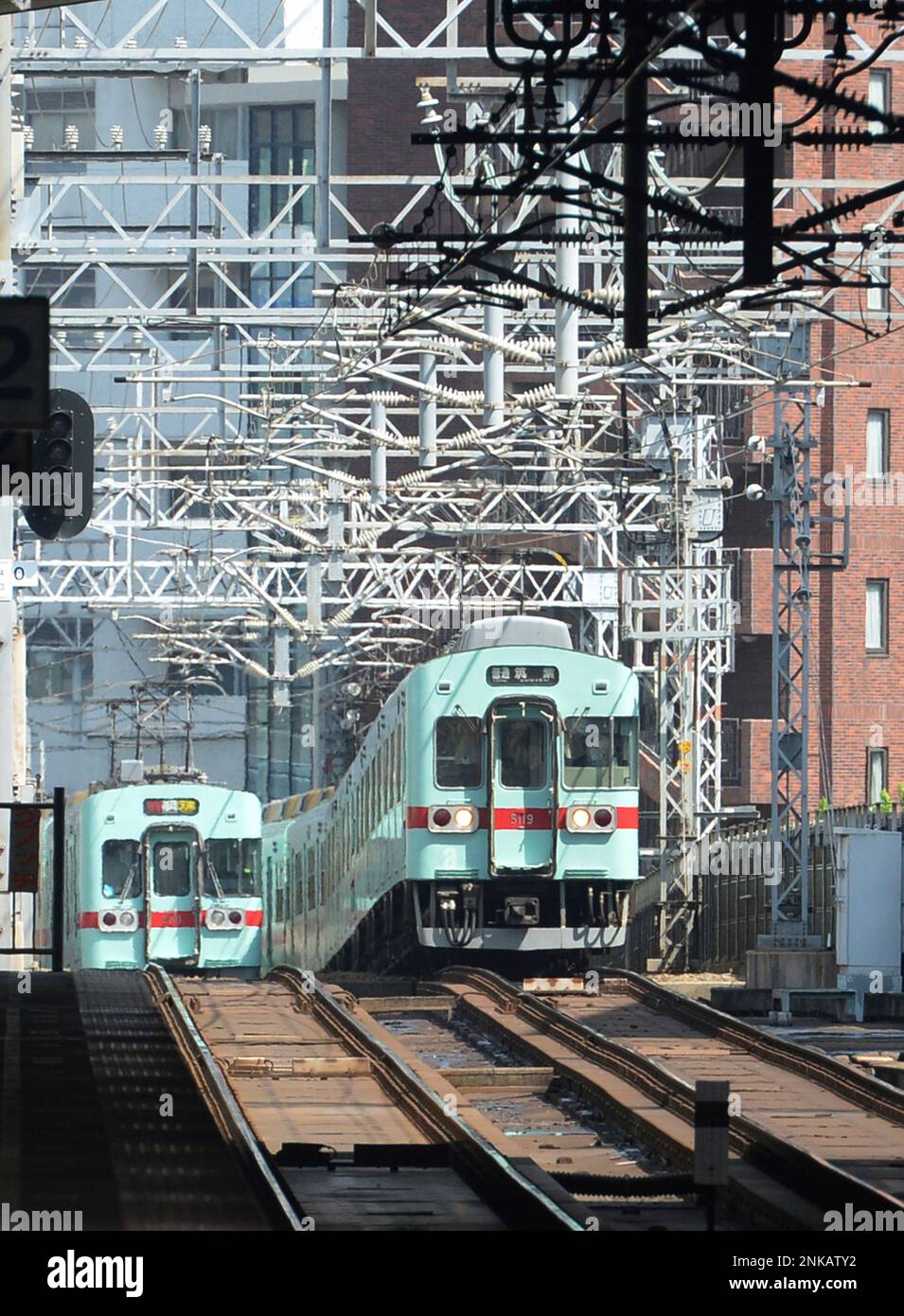 The trains of Nishi-Nippon Railroad Co., Ltd. run in Fukuoka City ...
