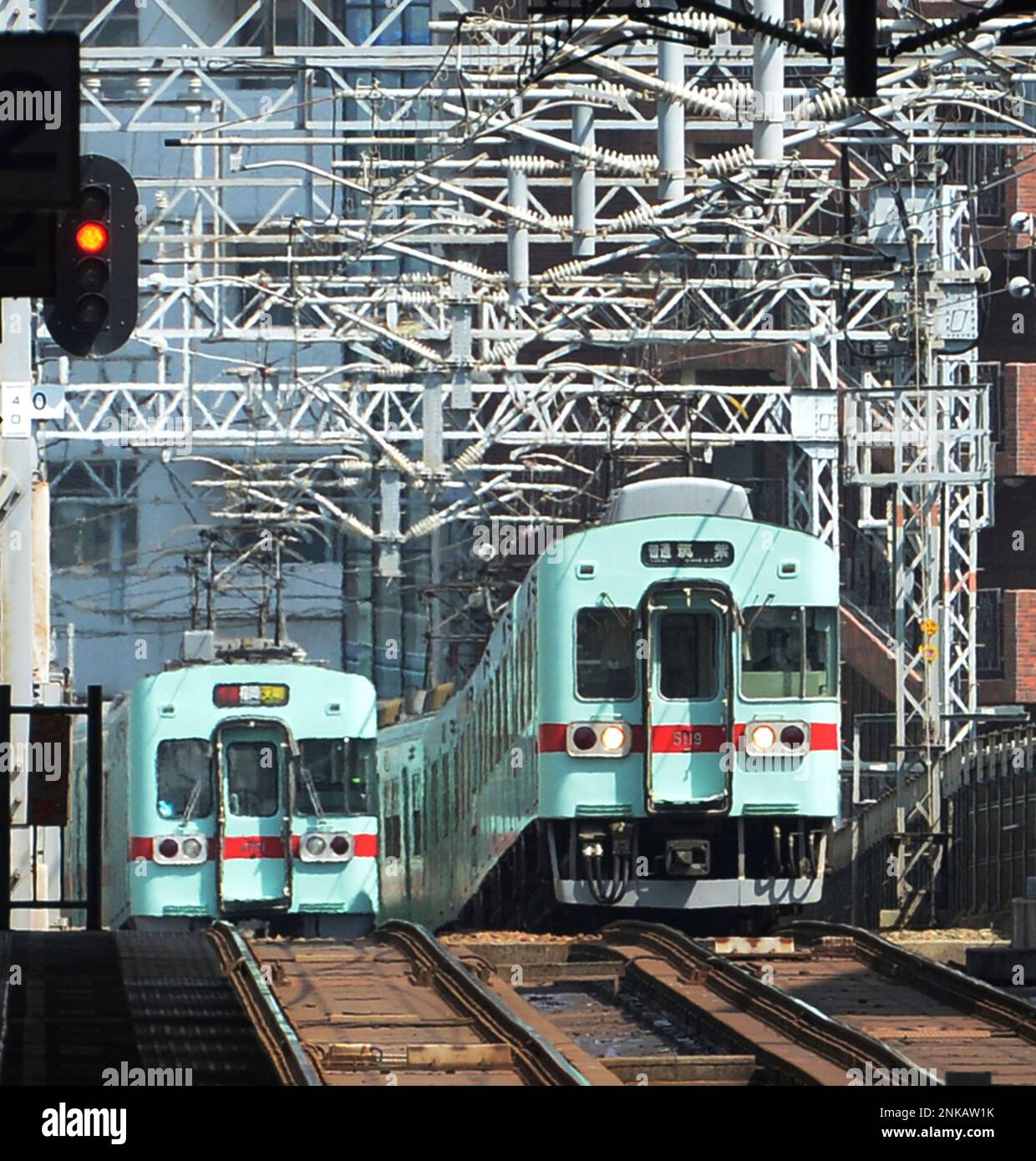 The trains of Nishi-Nippon Railroad Co., Ltd. run in Fukuoka City ...