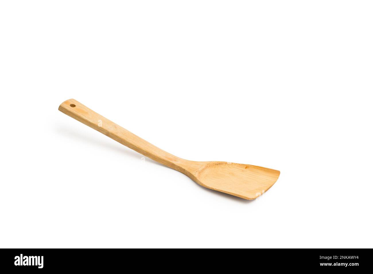 Brown wooden cooking spatula isolated on a white background with copy ...