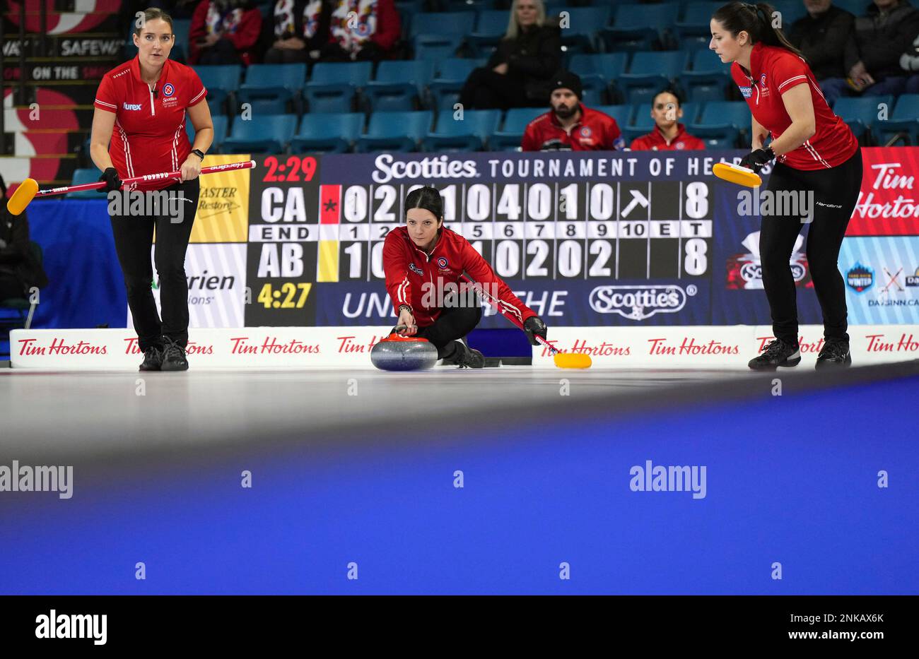 Team Canada skip Kerri Einarson, center, delivers her last rock in the ...
