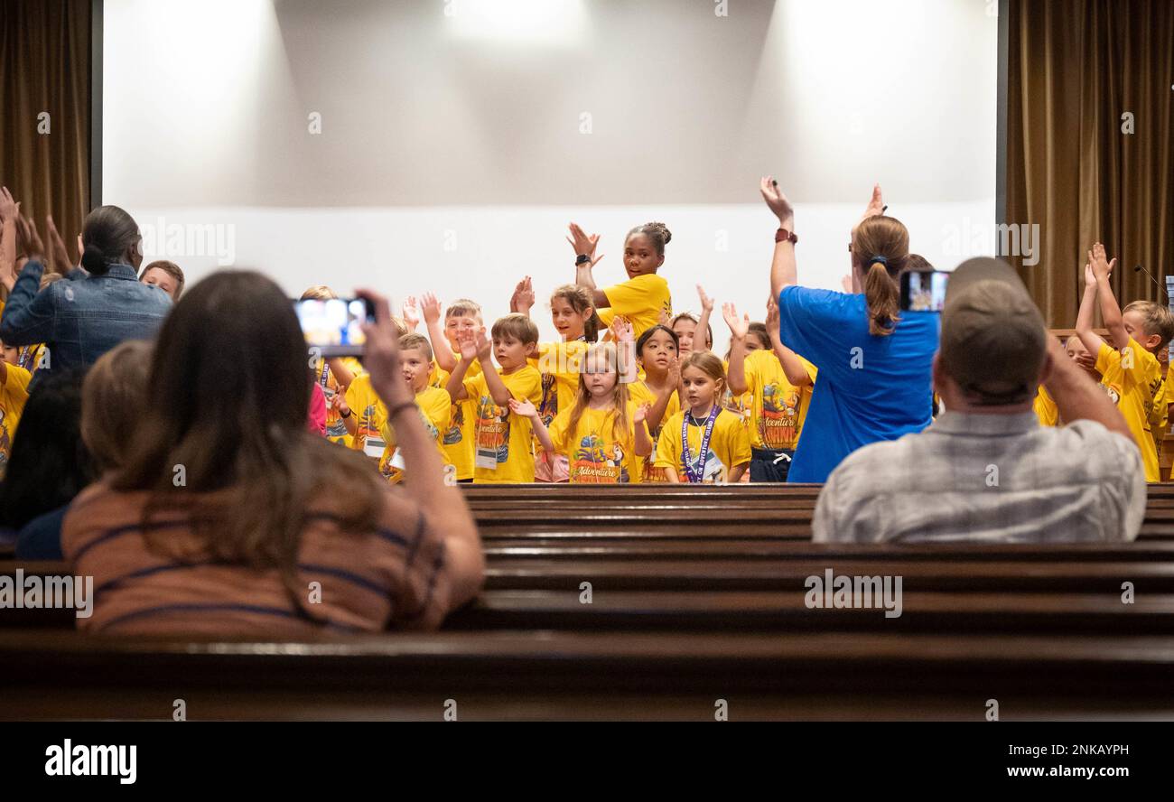 Children sing during a performance for their parents at the Fort ...