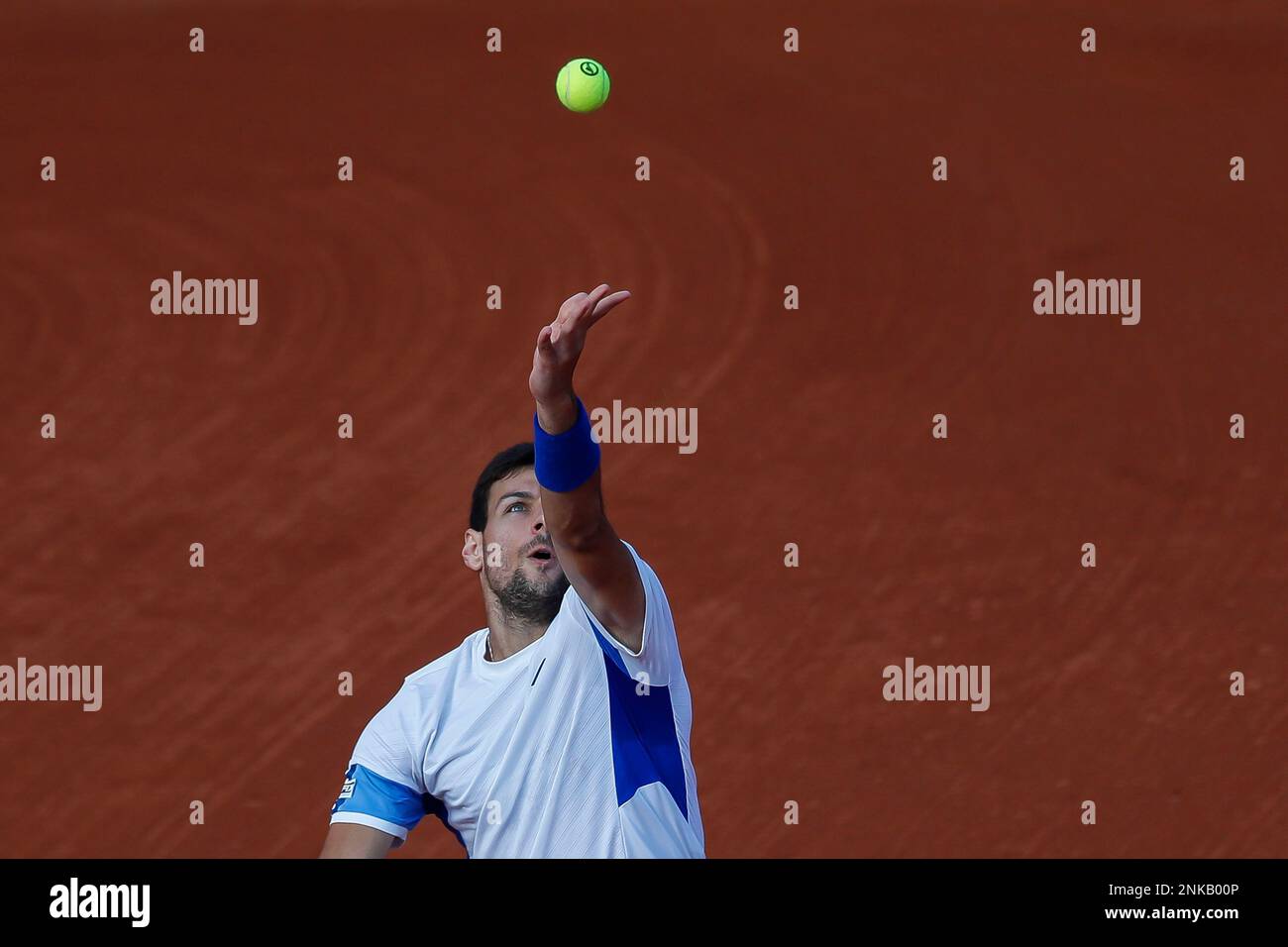 Bernabe Zapata Miralles of Spain serves the ball to Francisco Cerundolo ...