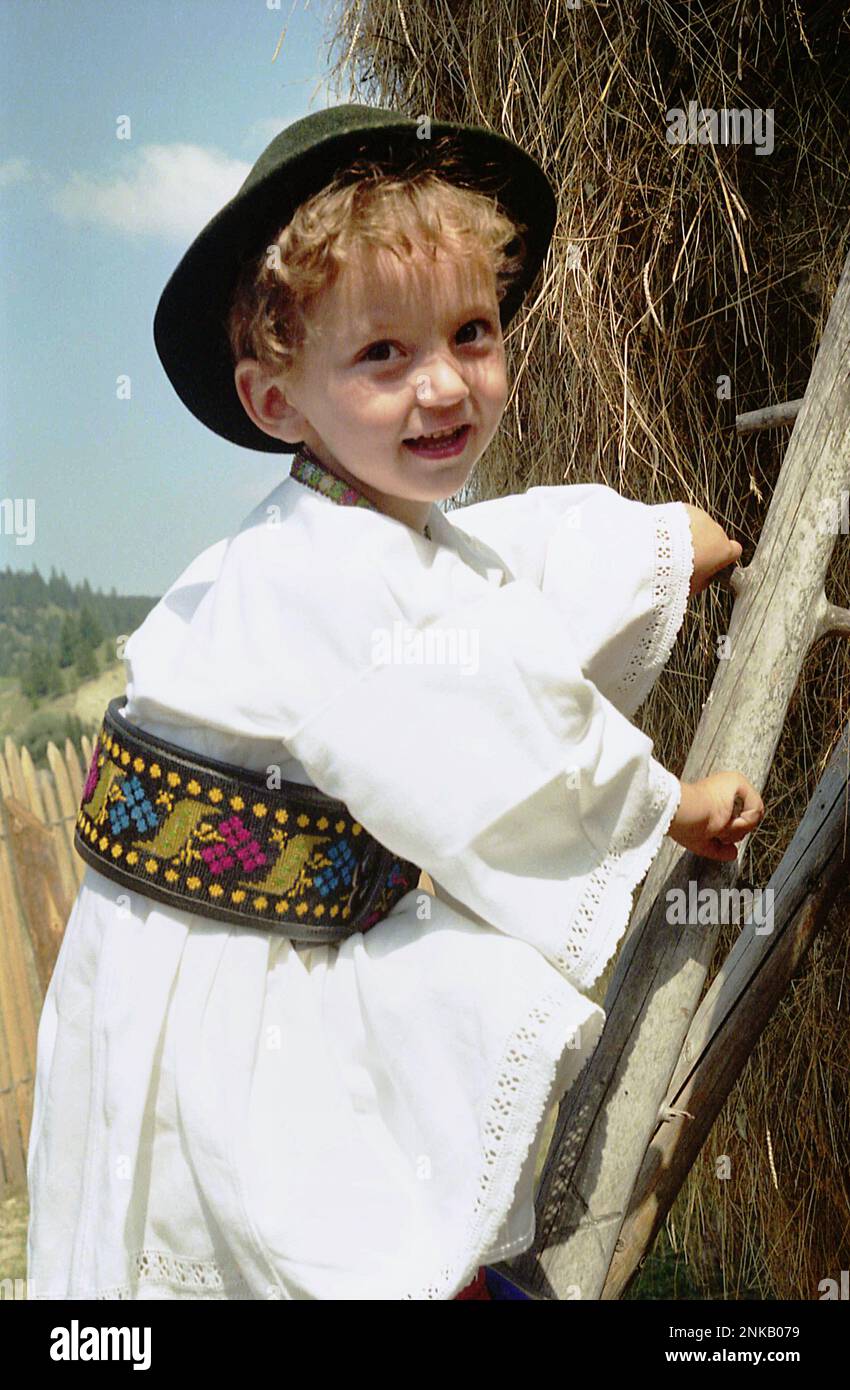 Cute kid dressed in an authentic traditional clothing in Suceava County ...