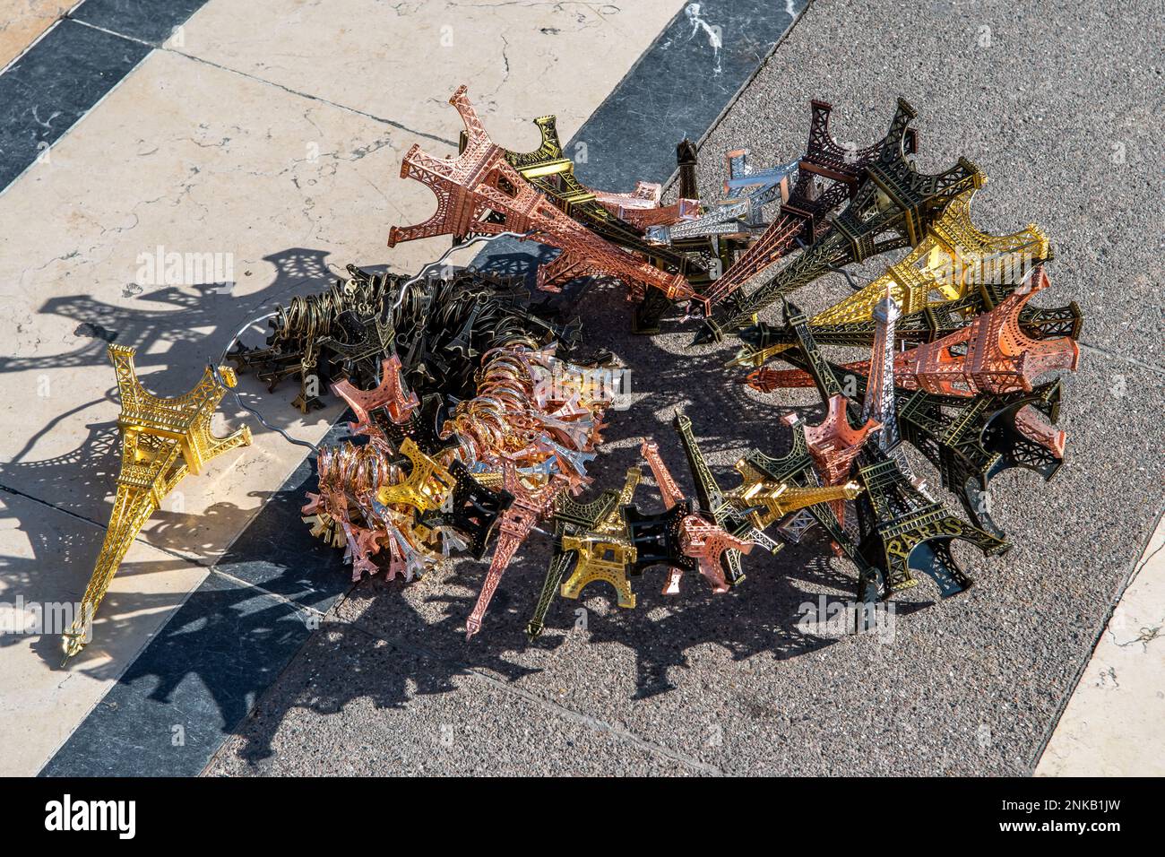 Pile With Small Sculptures Of Eiffel Tower On Display From A Street ...
