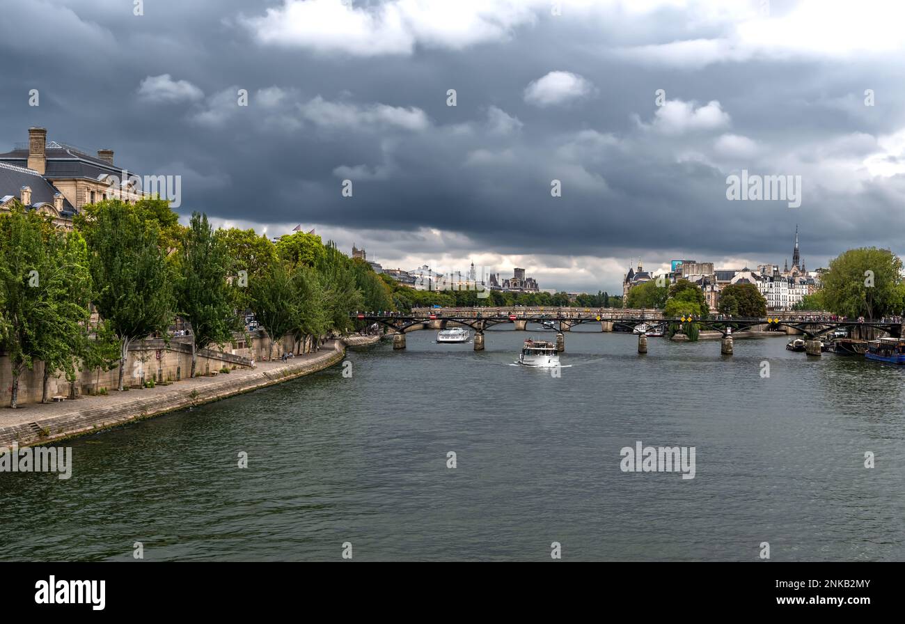 River Seine With Tourist Boat and Bridge Pont Neuf In Front Of ...