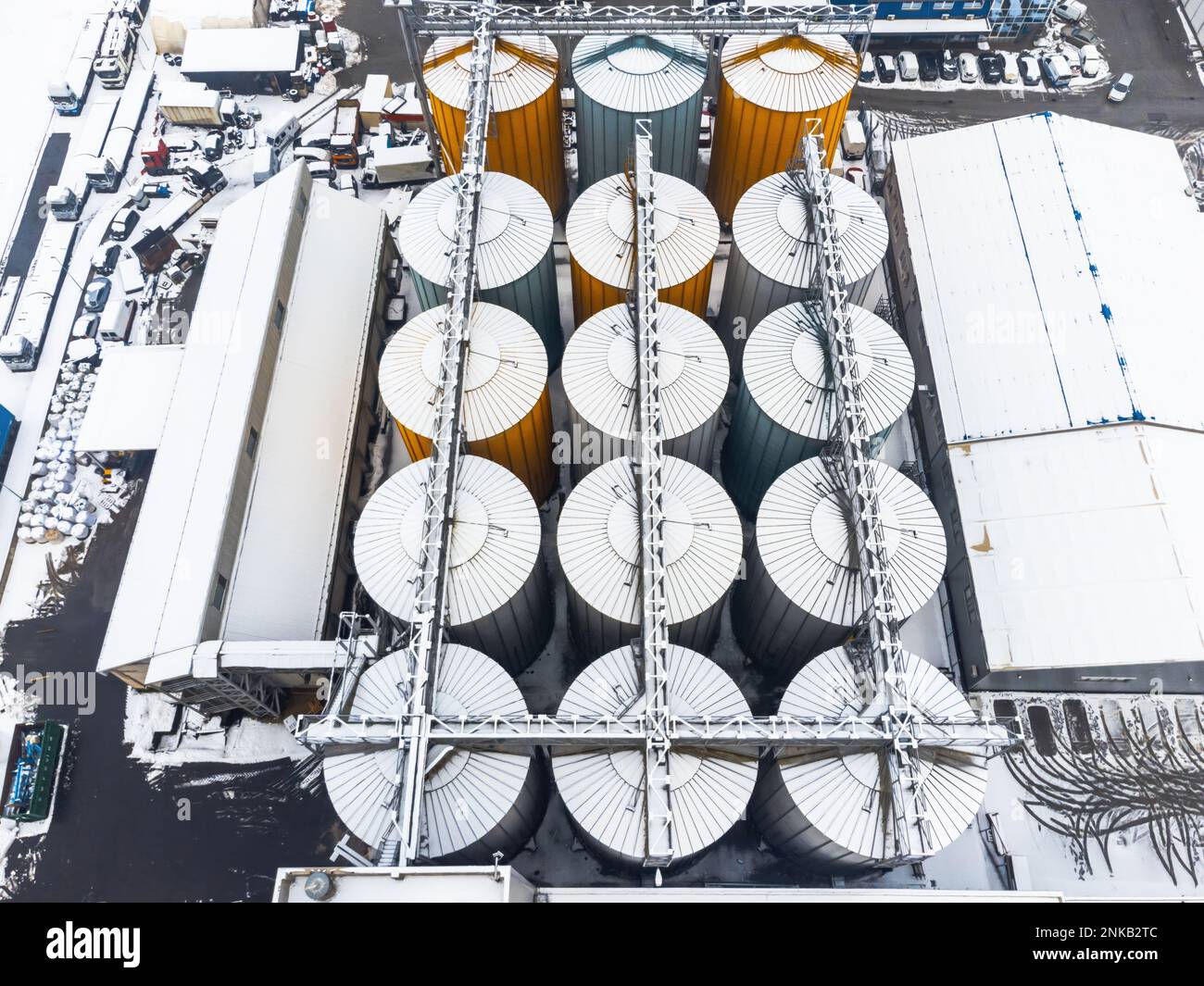 Storage silos side aerial view in winter. Covered in snow. Industrial ...