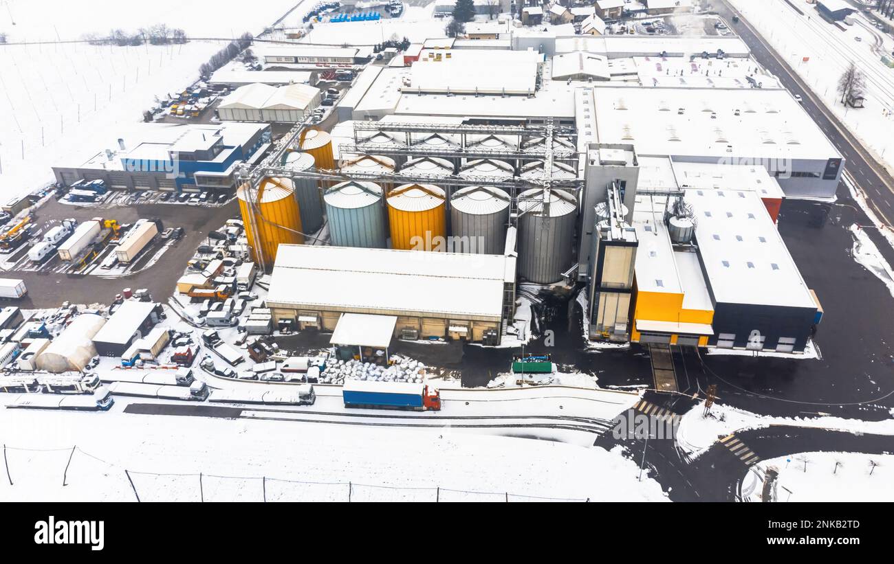 Storage silos side aerial view in winter. Covered in snow. Industrial ...