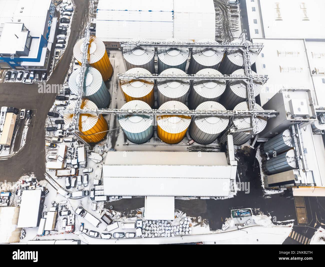 Storage silos side aerial view in winter. Covered in snow. Industrial ...
