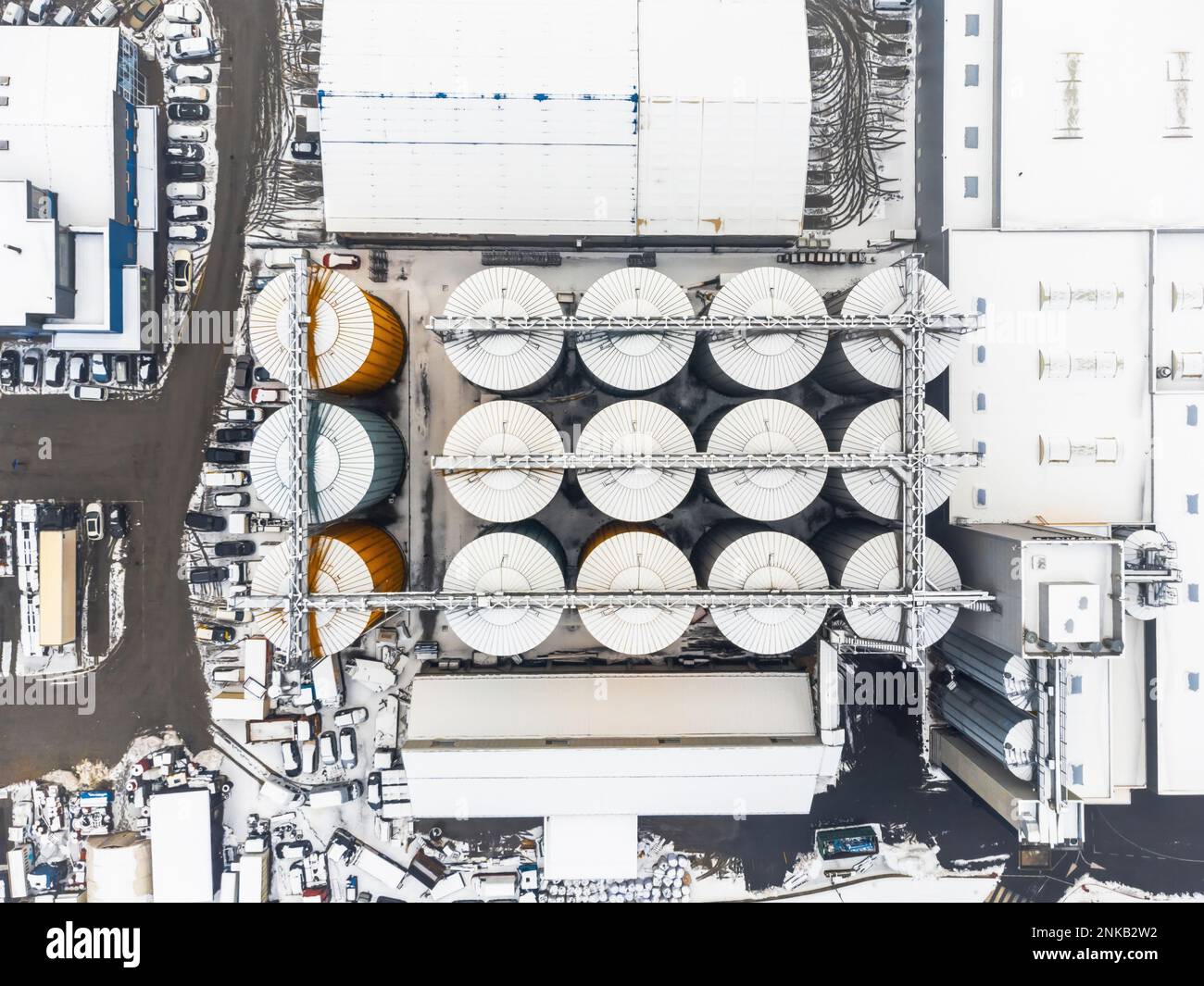 Storage silos side aerial view in winter. Covered in snow. Industrial ...