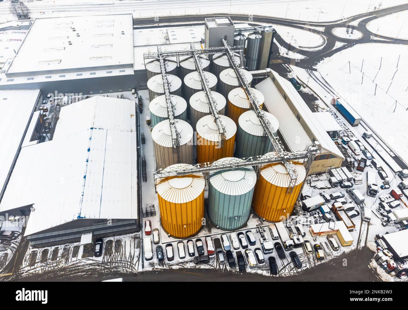Storage silos side aerial view in winter. Covered in snow. Industrial ...