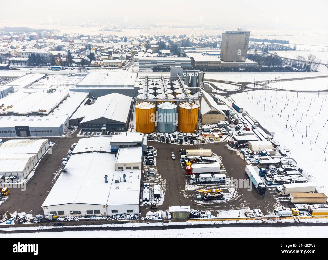 Storage silos side aerial view in winter. Covered in snow. Industrial ...