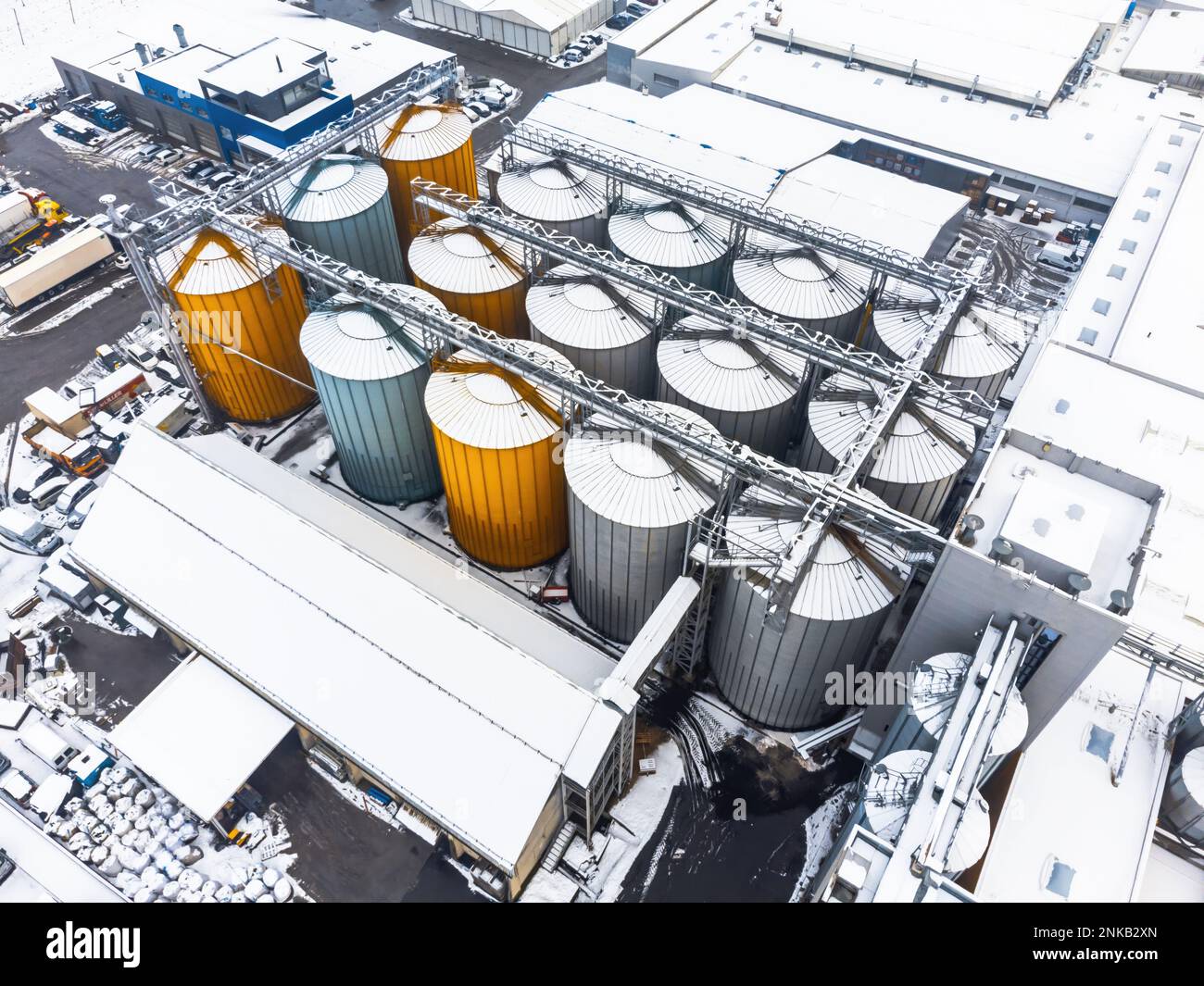 Storage silos side aerial view in winter. Covered in snow. Industrial ...