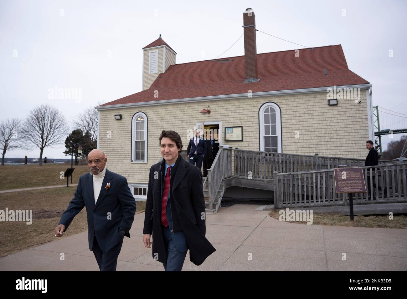 Prime Minister Justin Trudeau, right, walks with Percy Paris after ...