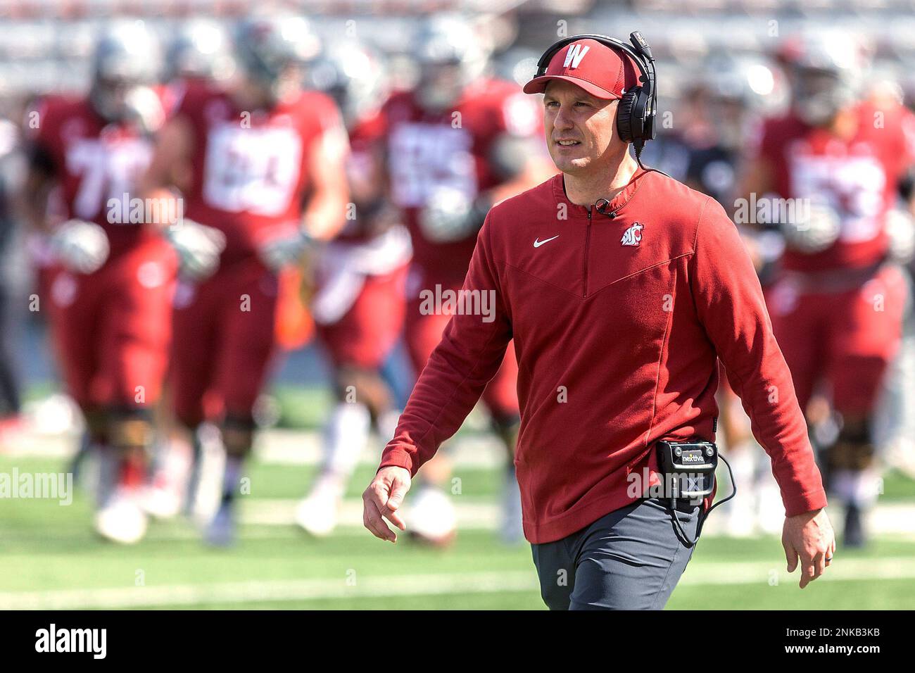 Washington State coach Jake Dickert walks across the field during the ...