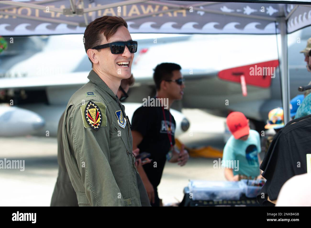 An F-22 Raptor pilot, assigned to the 199th Fighter Squadron, answers ...