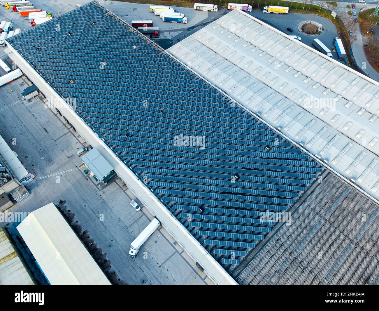 Large solar panel array farm on a distribution warehouse building with ...