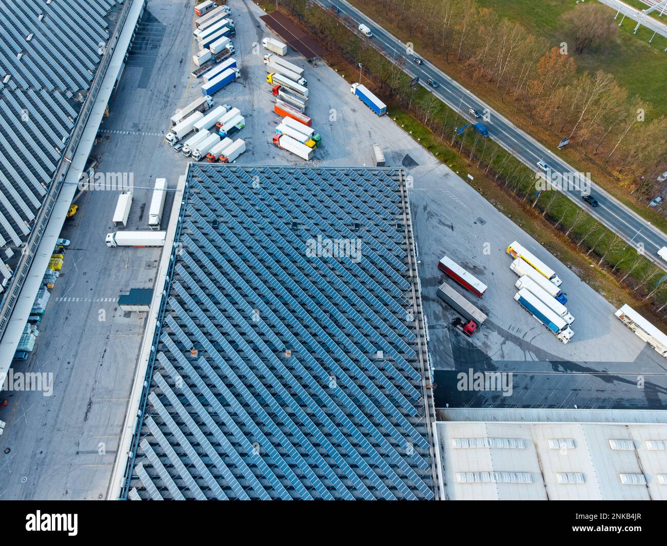 Large solar panel array farm on a distribution warehouse building with ...